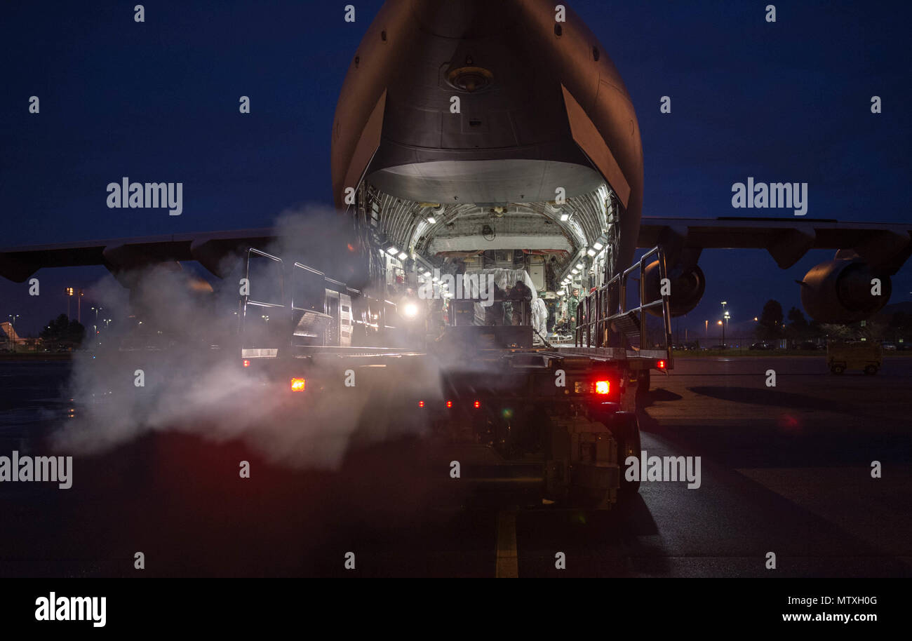 Airmen from the 821st Contingency Response Squadron, uses a K-loader to ...