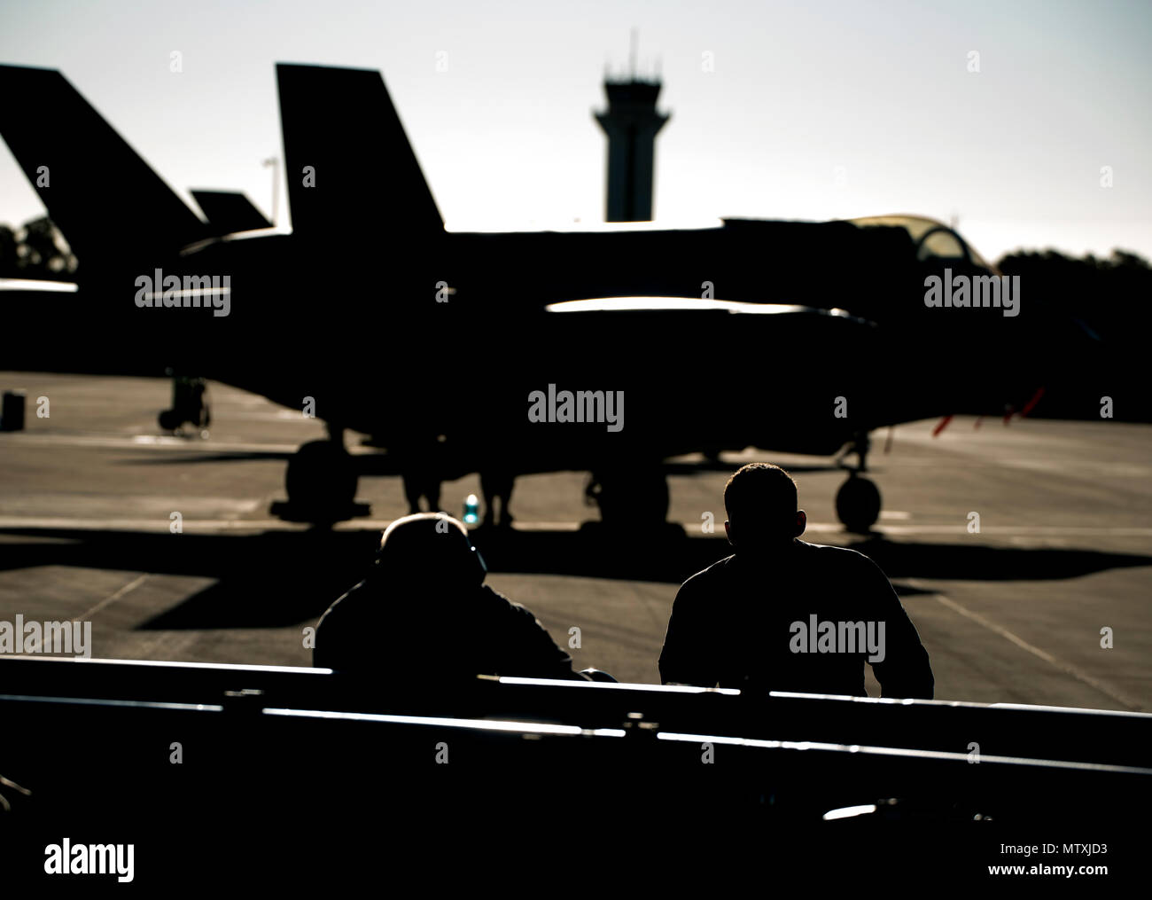 A U.S. Air Force weapons load crew assigned to the 33rd Aircraft Maintenance Squadron loads a ...
