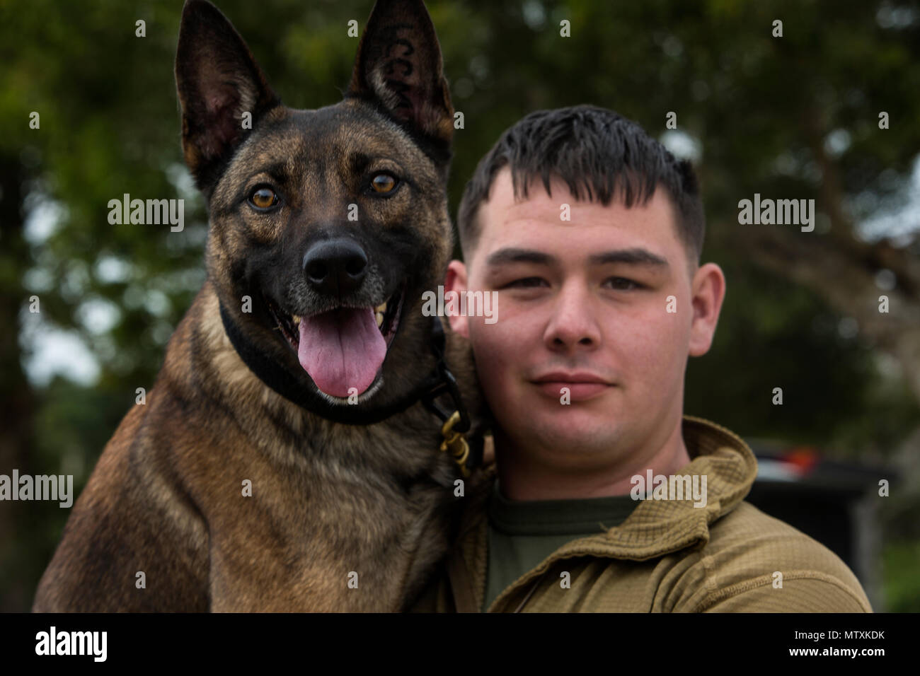 Cpl. Jason E. Casbeer and his military working dog, Mac, wait to train ...