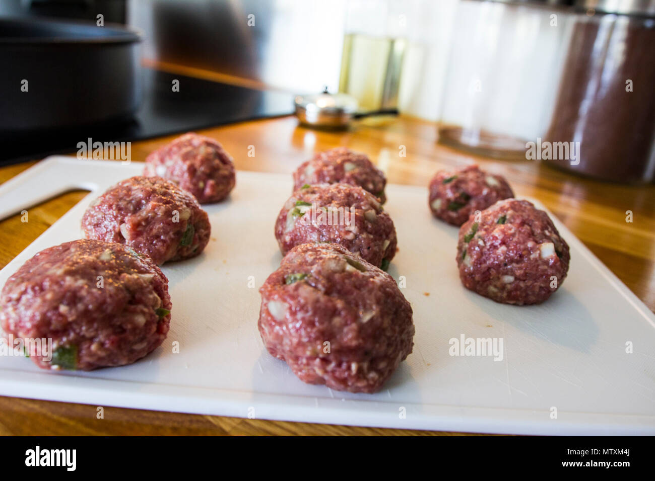 Making meatballs in a kitchen Stock Photo - Alamy
