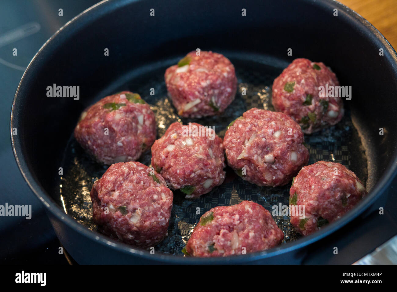 Making meatballs in a kitchen Stock Photo - Alamy