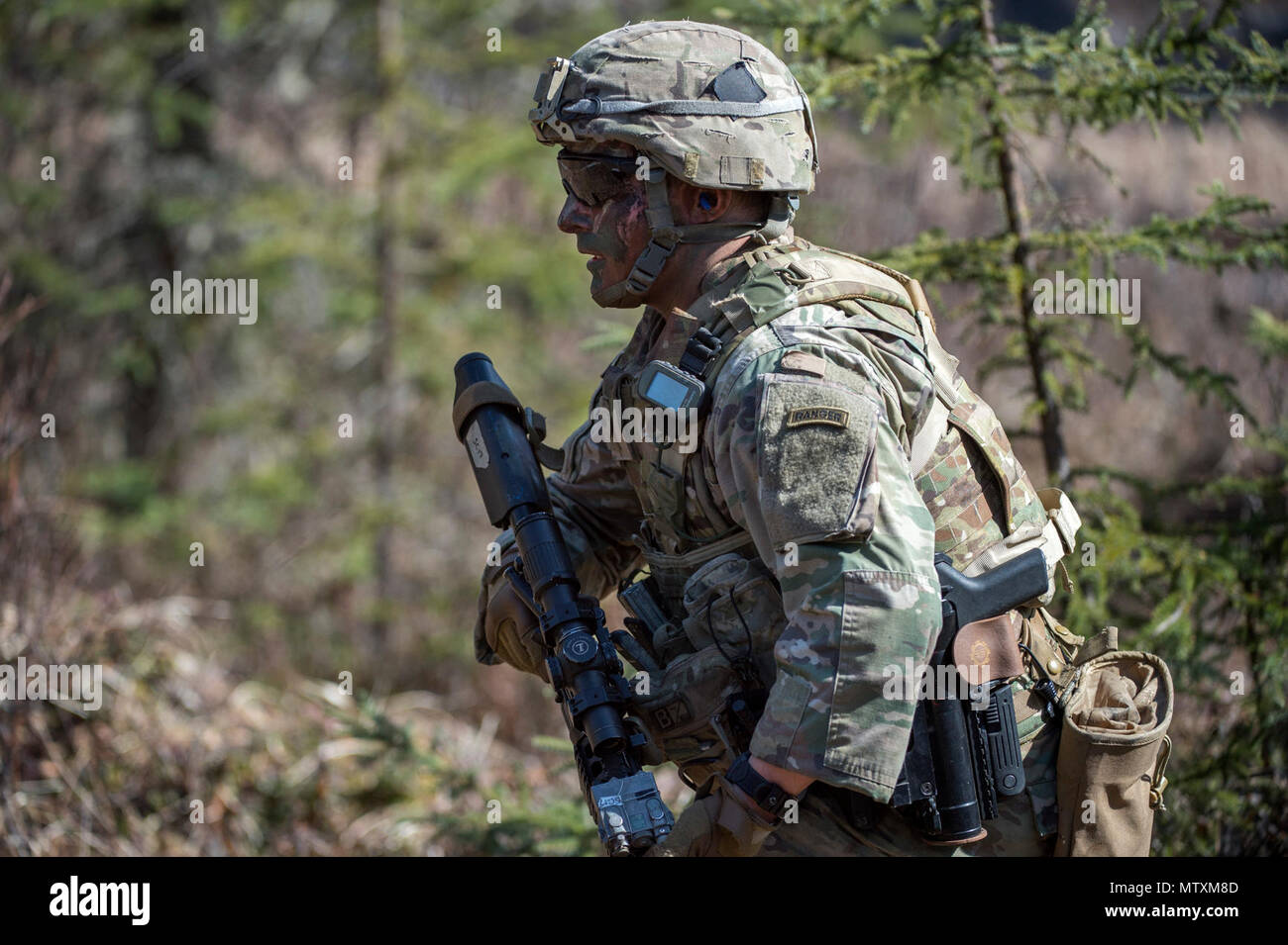 A paratrooper assigned to Scout Platoon, Headquarters and Headquarters ...