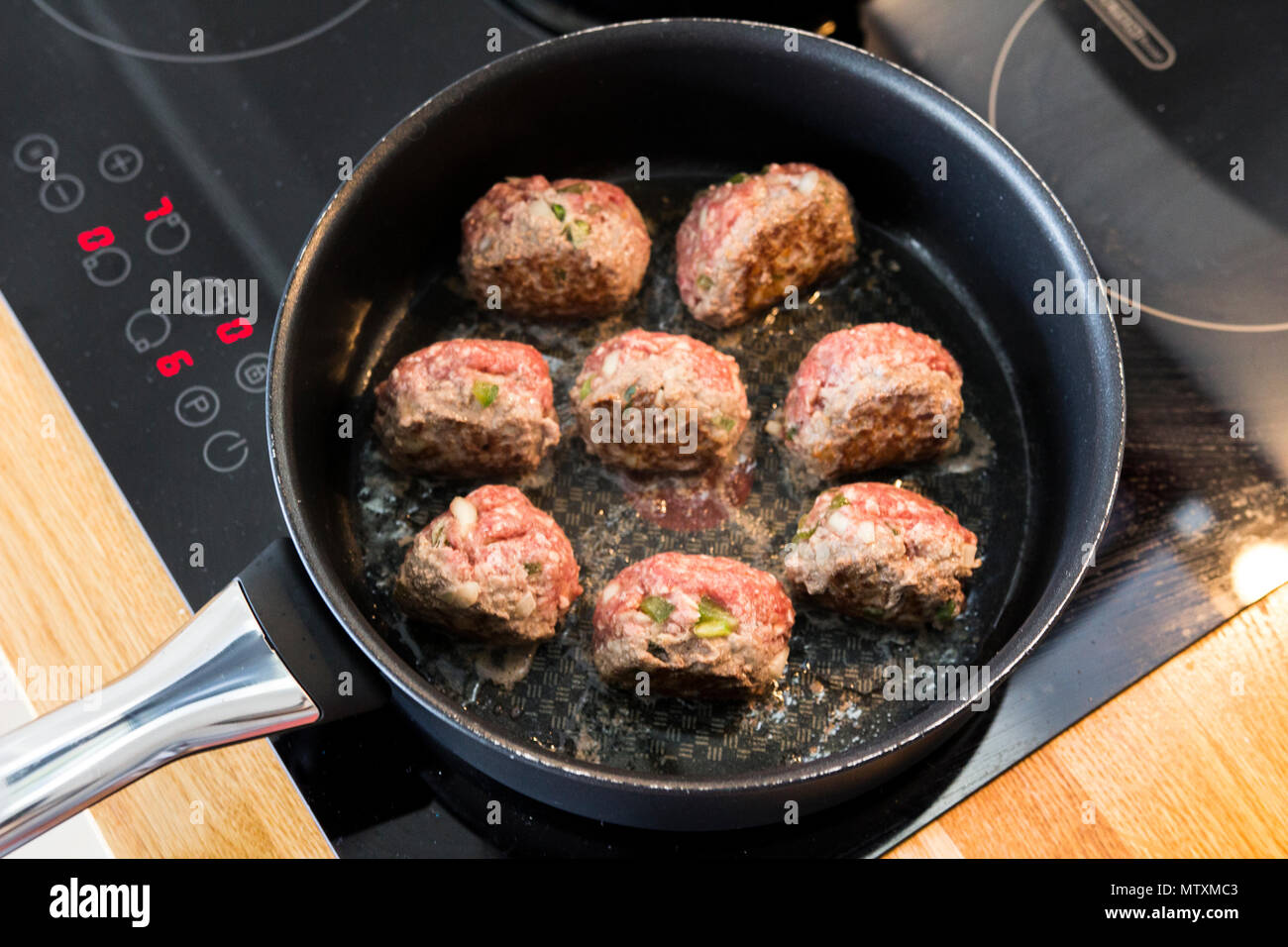 Making meatballs in a kitchen Stock Photo - Alamy