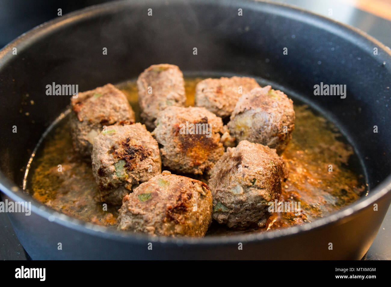 Making meatballs in a kitchen Stock Photo - Alamy