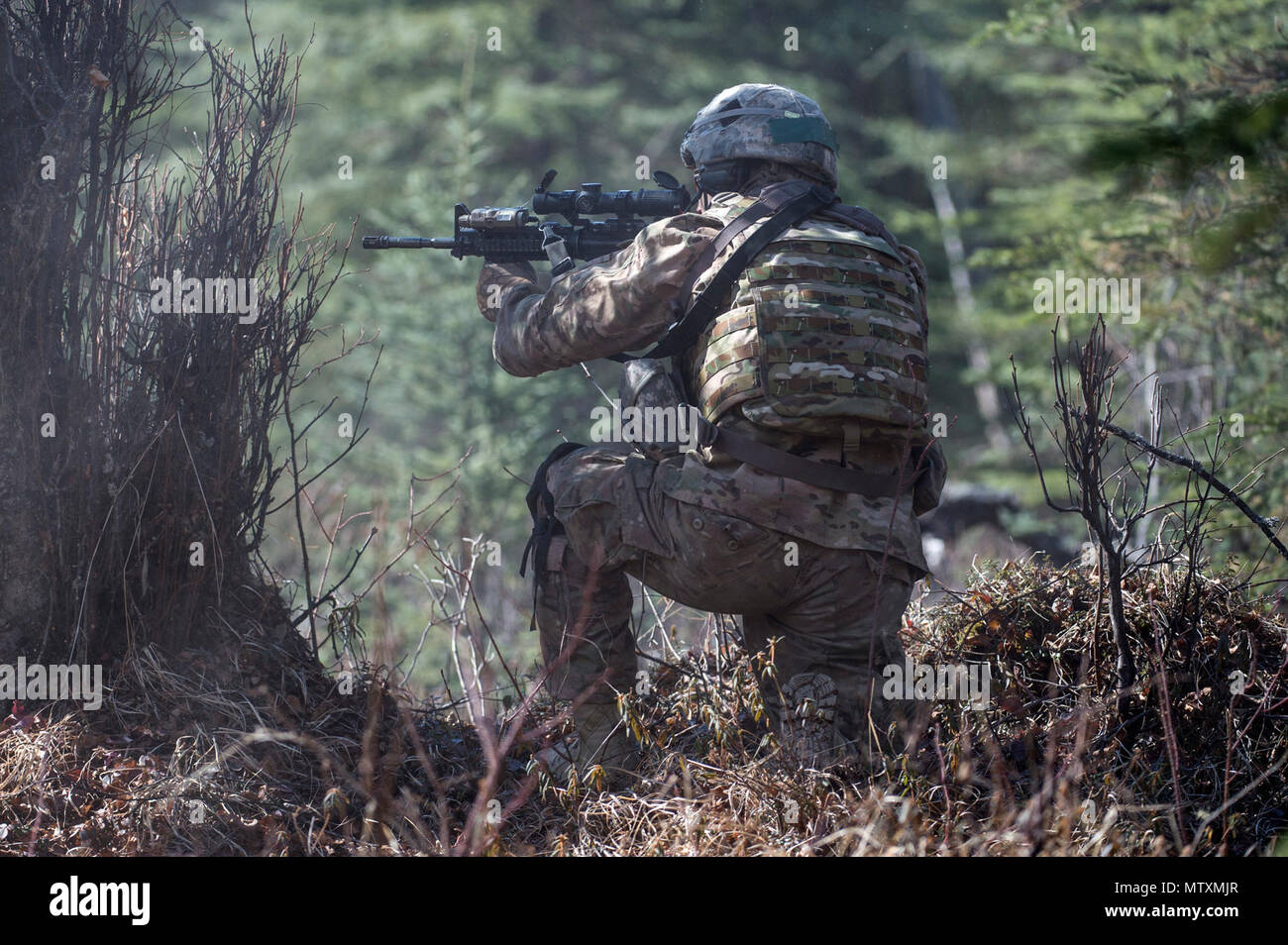 A paratrooper assigned to Scout Platoon, Headquarters and Headquarters ...