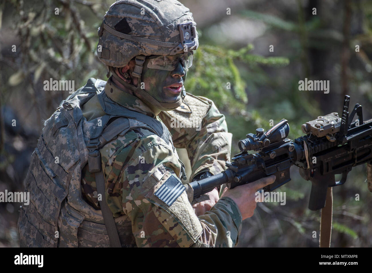 A paratrooper assigned to Scout Platoon, Headquarters and Headquarters ...
