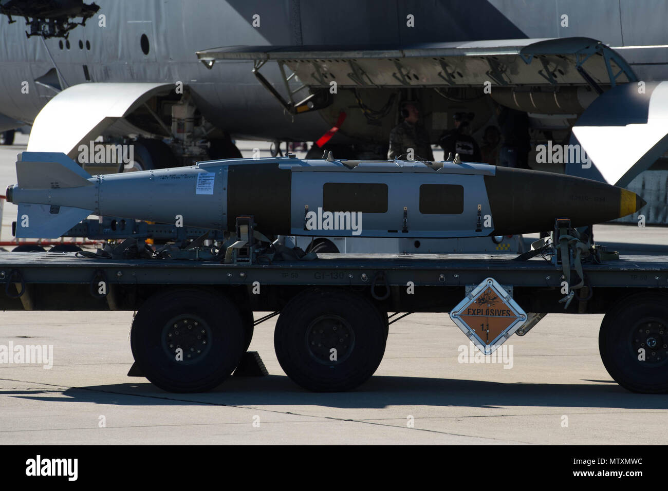 A 2000 pound Joint Direct Attack Munition awaits loading onto a ...