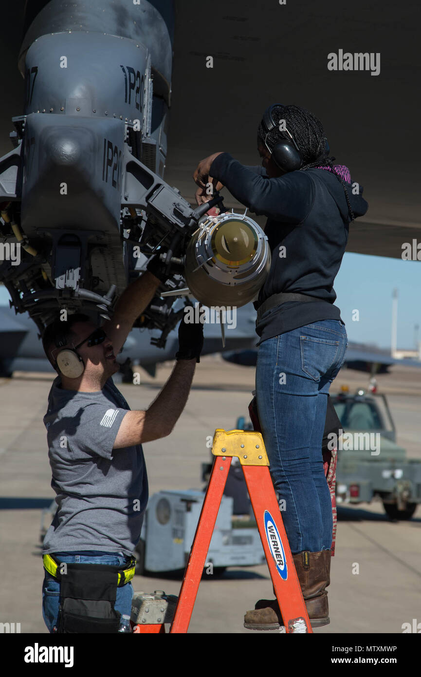 Airmen from the 307th Aircraft Maintenance Squadron load a 500 pound ...