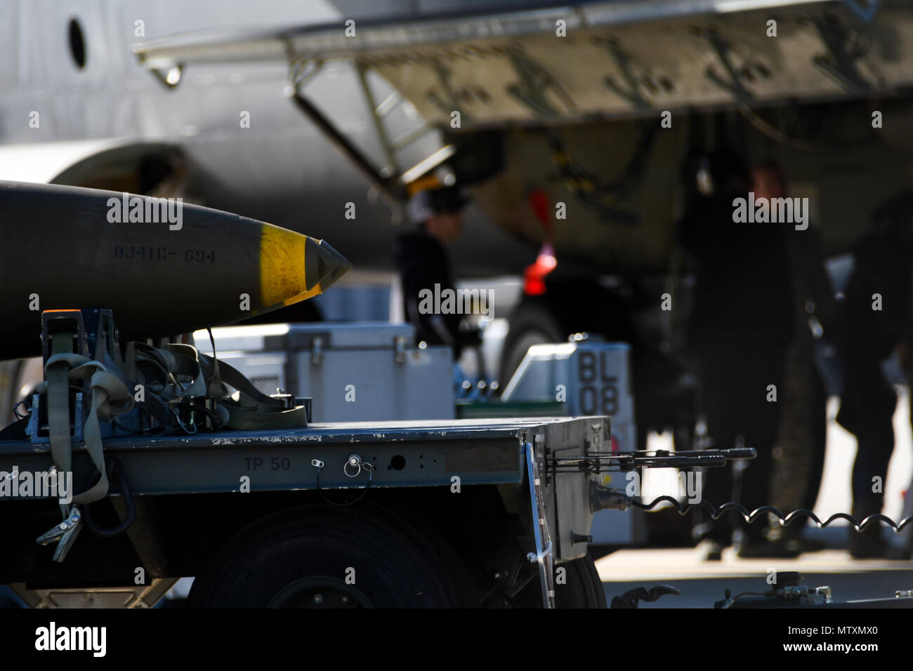 Airmen from the 307th Aircraft Maintenance Squadron inspect the bomb ...