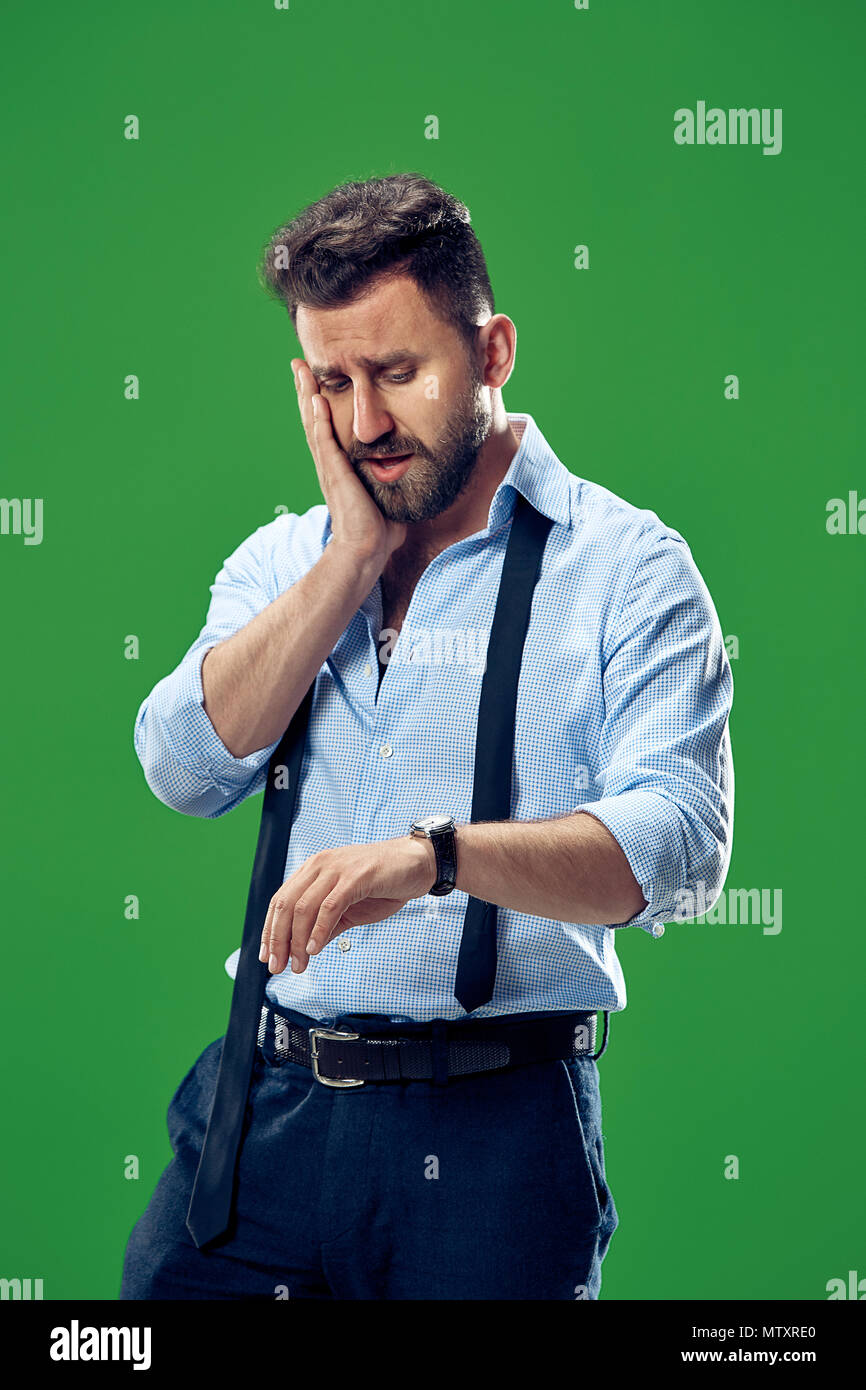Handsome businessman checking his wrist-watch Isolated on white ...