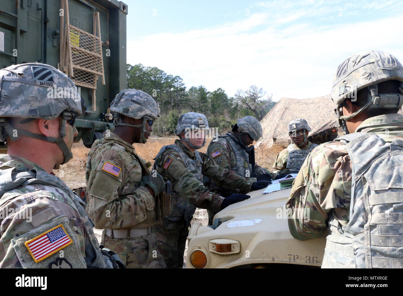 2nd Lt. Anthony Jackson (right), distribution platoon leader with Alpha ...