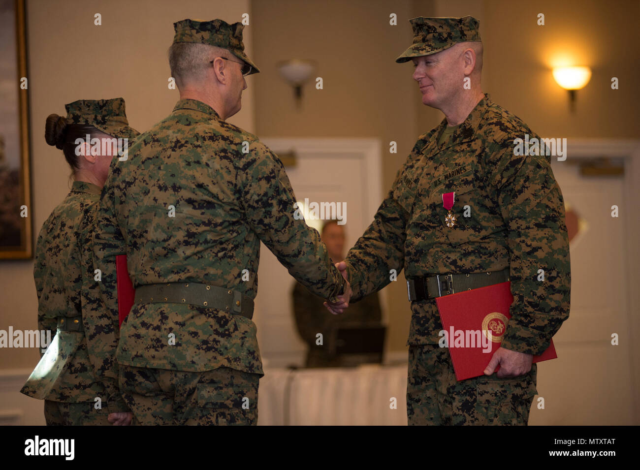U.S. Marine Corps Sgt. Maj. David M. Reaves, right, outgoing sergeant ...
