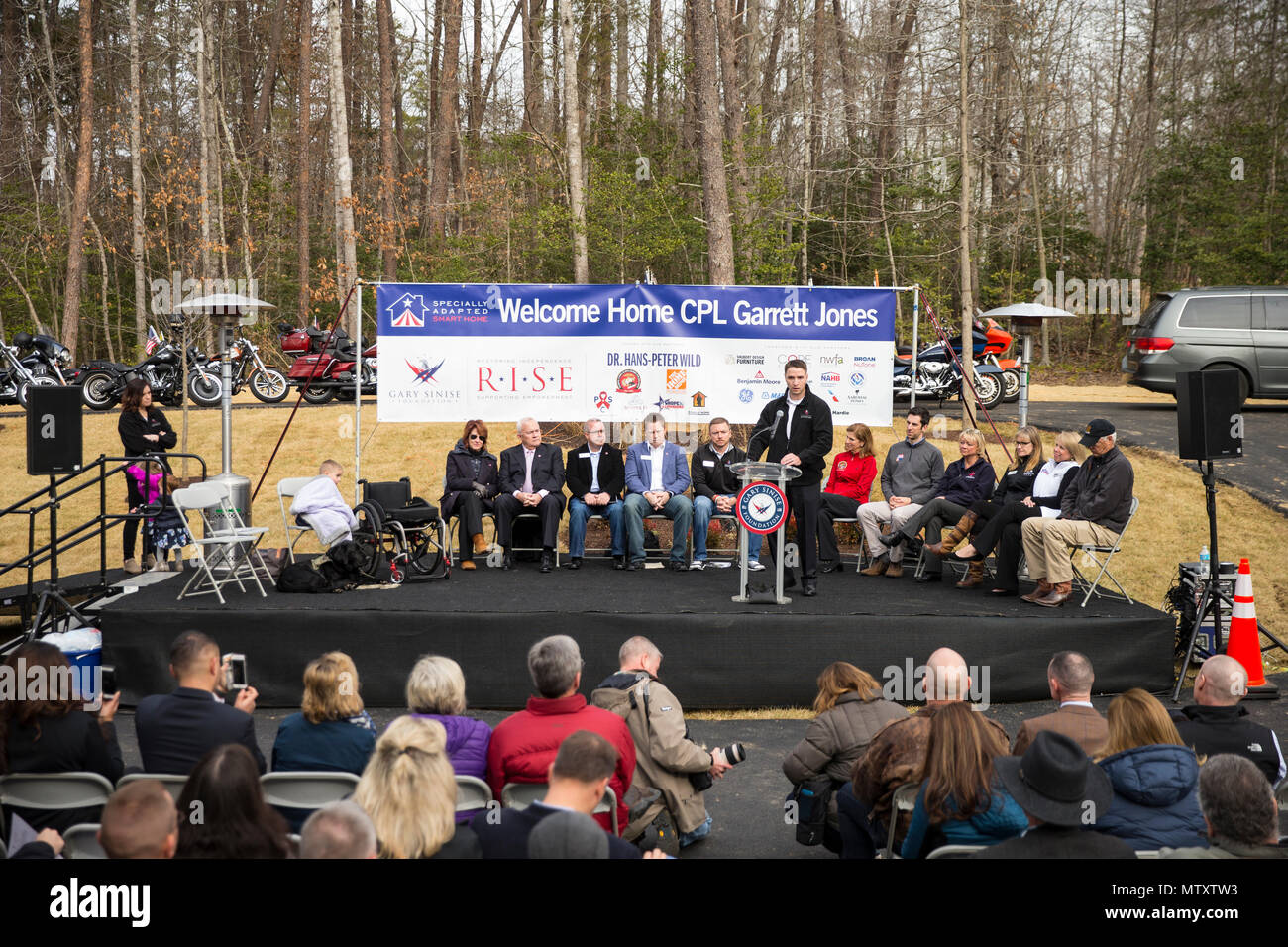Retired U.S. Marine Corps Cpl. Garrett Jones speaks during the Smart ...