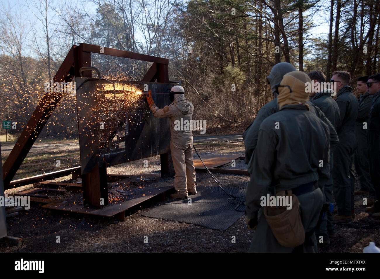 U.S. Marines attending the Methods of Entry (MOE) course, learn to use ...