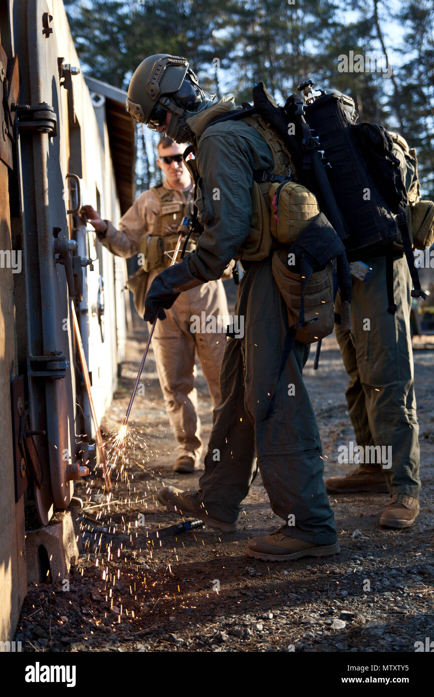 A U.S. Marine attending the Methods of Entry (MOE) course starts a ...
