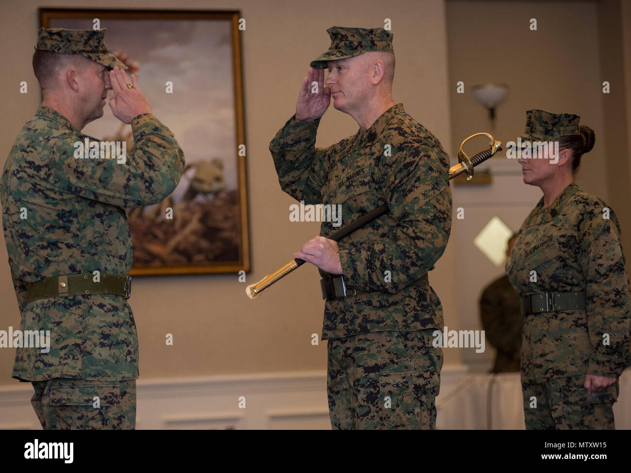 U.S. Marine Corps Sgt. Maj. David M. Reaves, center, outgoing sergeant ...