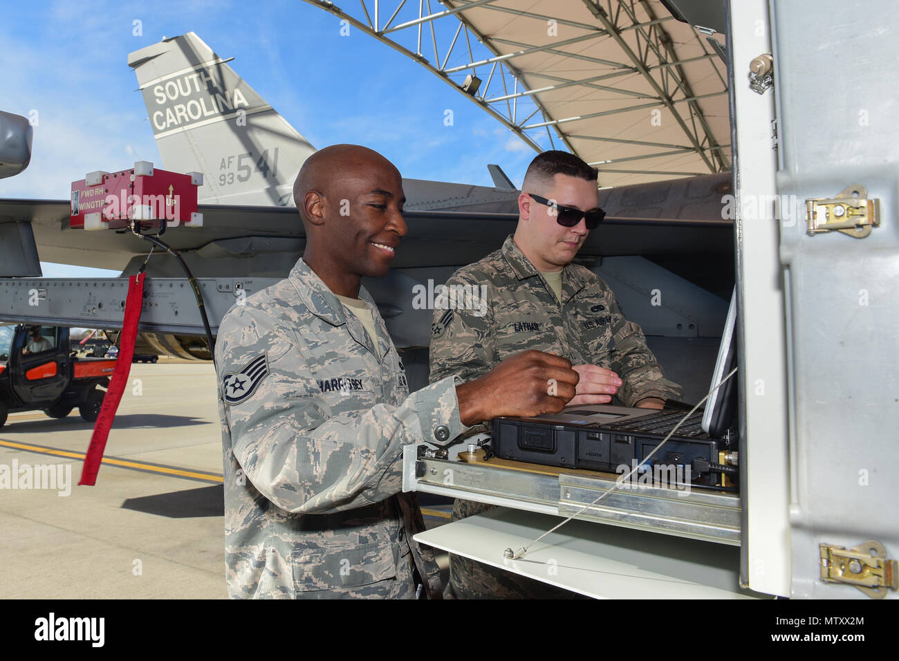 U.S. Air Force Staff Sgt. Timothy Harris-Bey, left, and Senior Airman ...