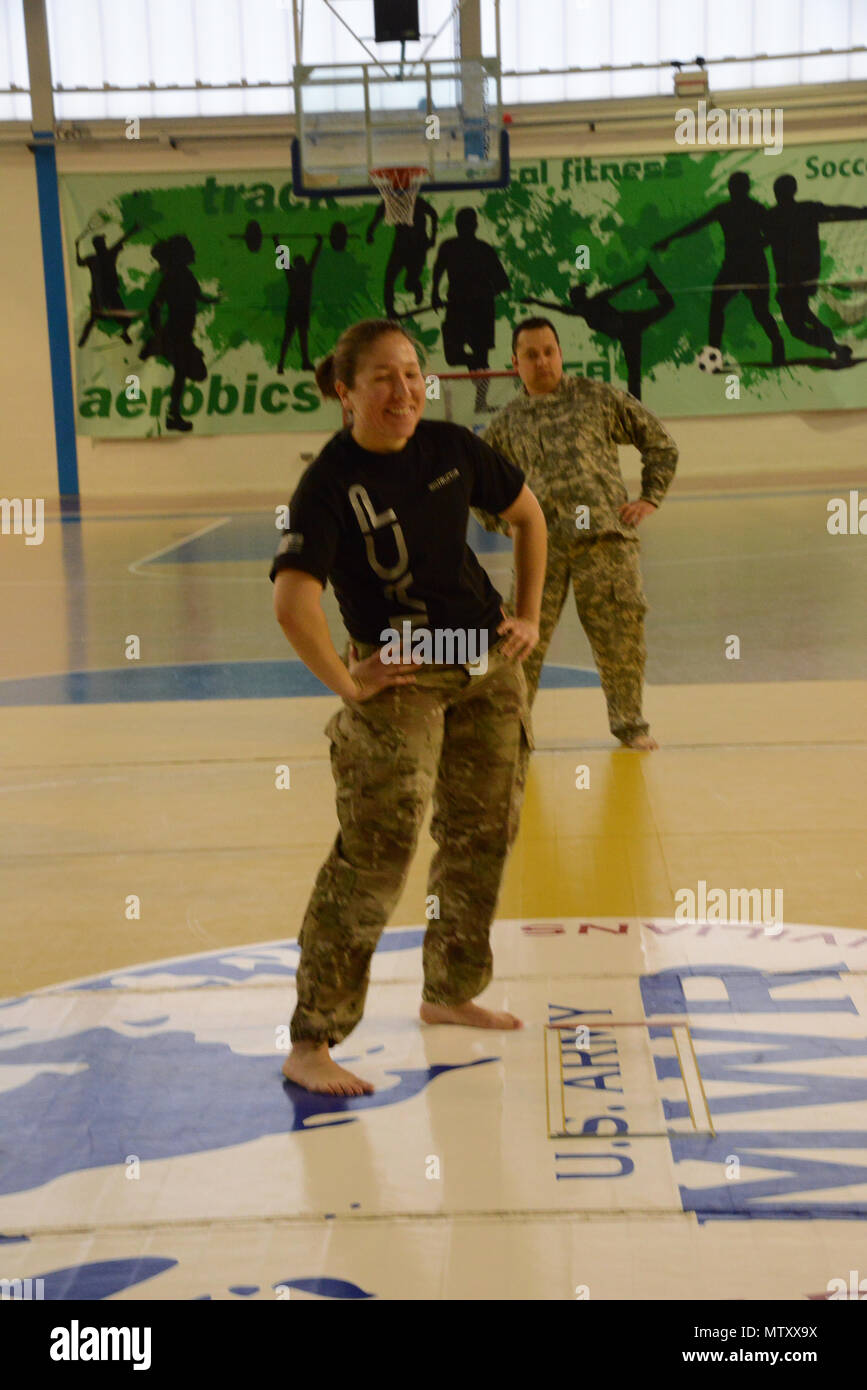 U.S. Army, Sgt. Maria Acuna, AFNORTH shows warm up exercises to U.S ...