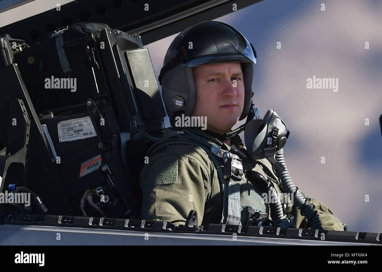 A 1st Fighter Wing F-22 Raptor pilot waits for his signal to taxi for ...