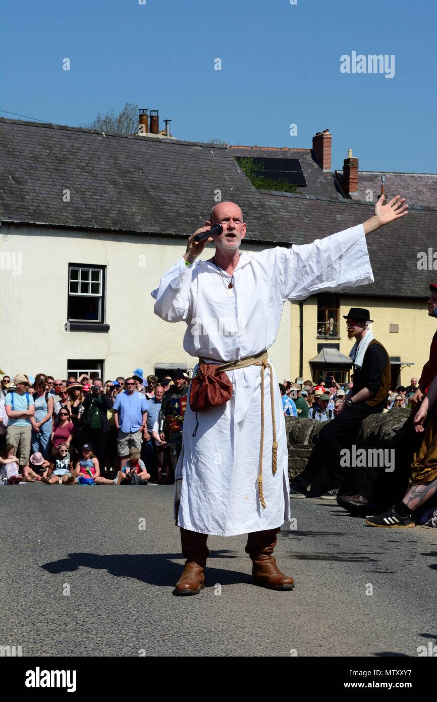 A pagan blessing on Clun Medieval bridge at the start of Clun Green man ...