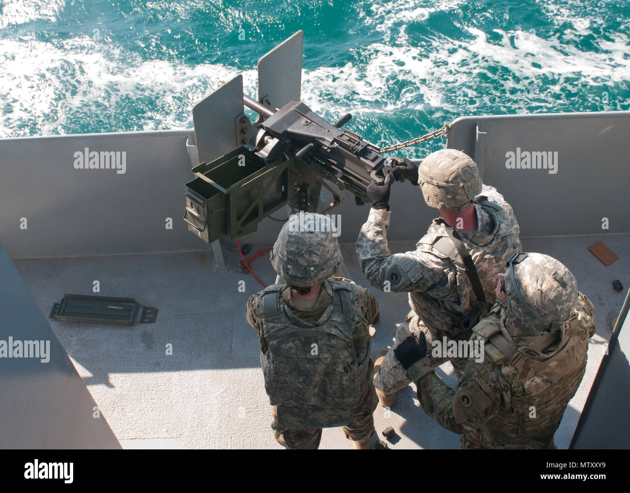 U.S. Army mariners, of the 411th Transportation Company, fire an Mark ...