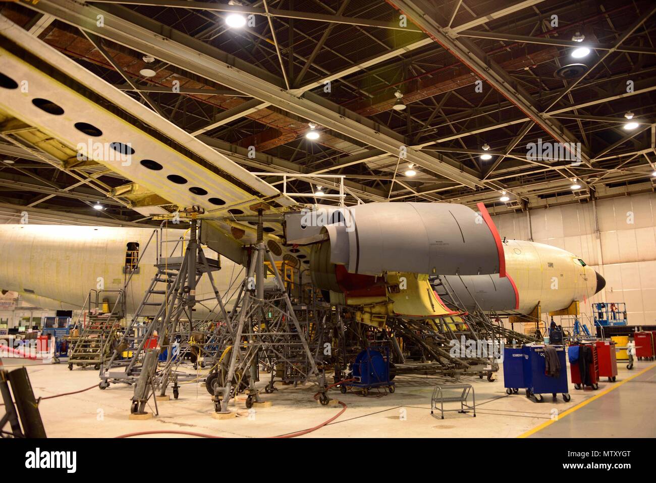 A KC-135R Stratotanker aircraft is stripped down for Periodic Depot ...