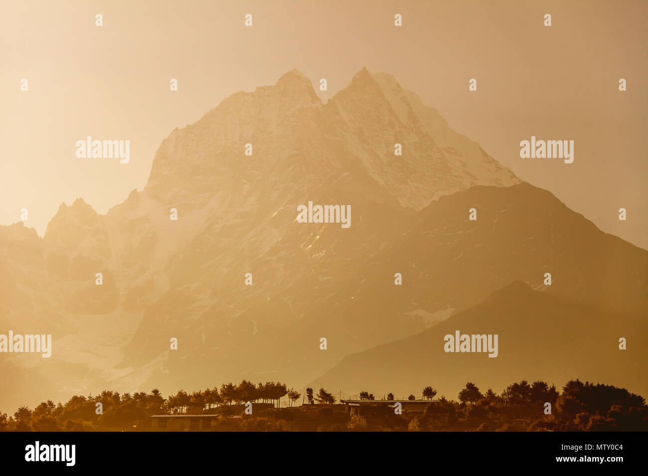 The misty Thamserku Mountain in the Namche Bazaar Region. The Himalayas ...