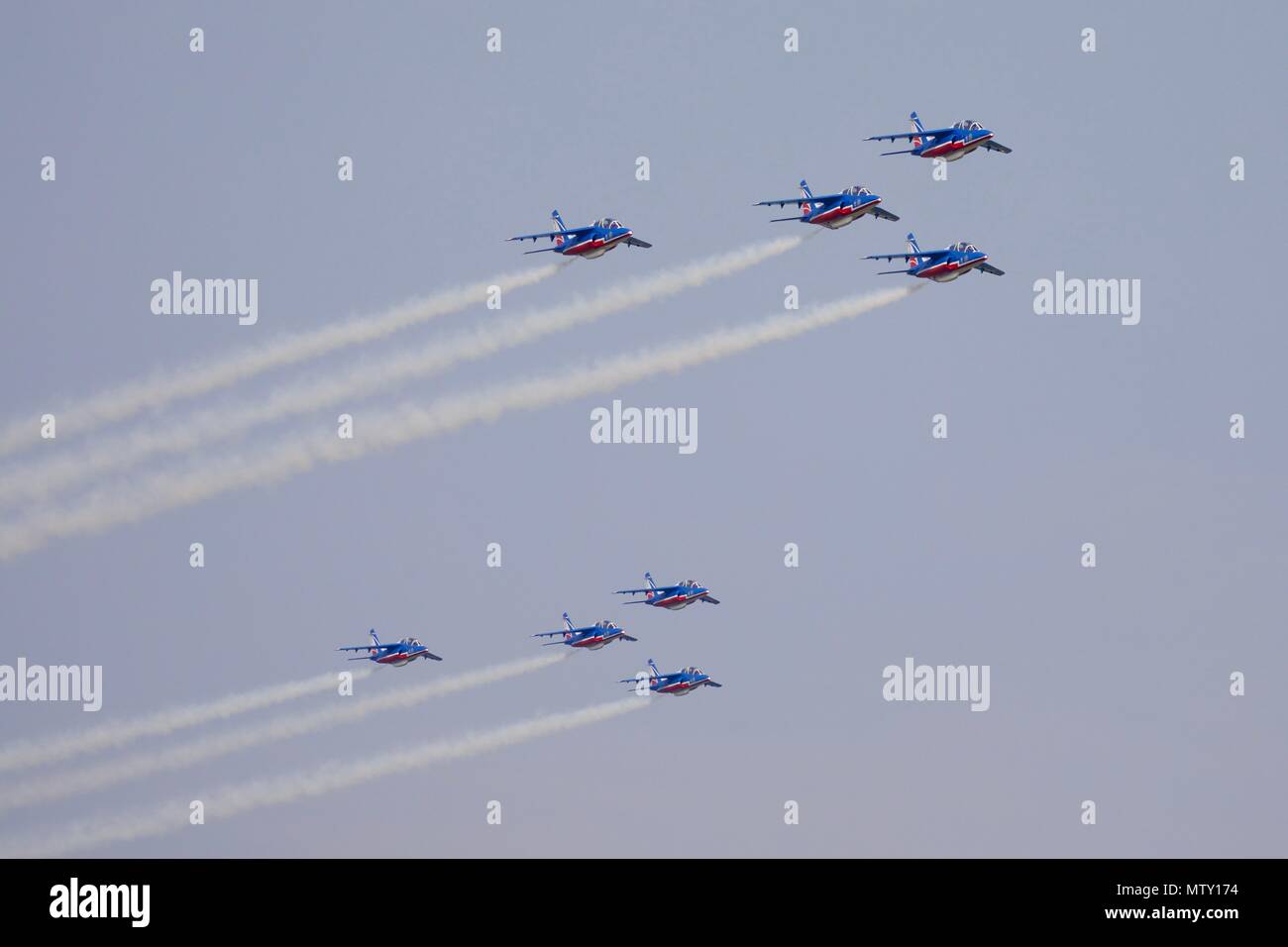 Eight French Alpha Jets of the Patrouille de France flying in formation ...