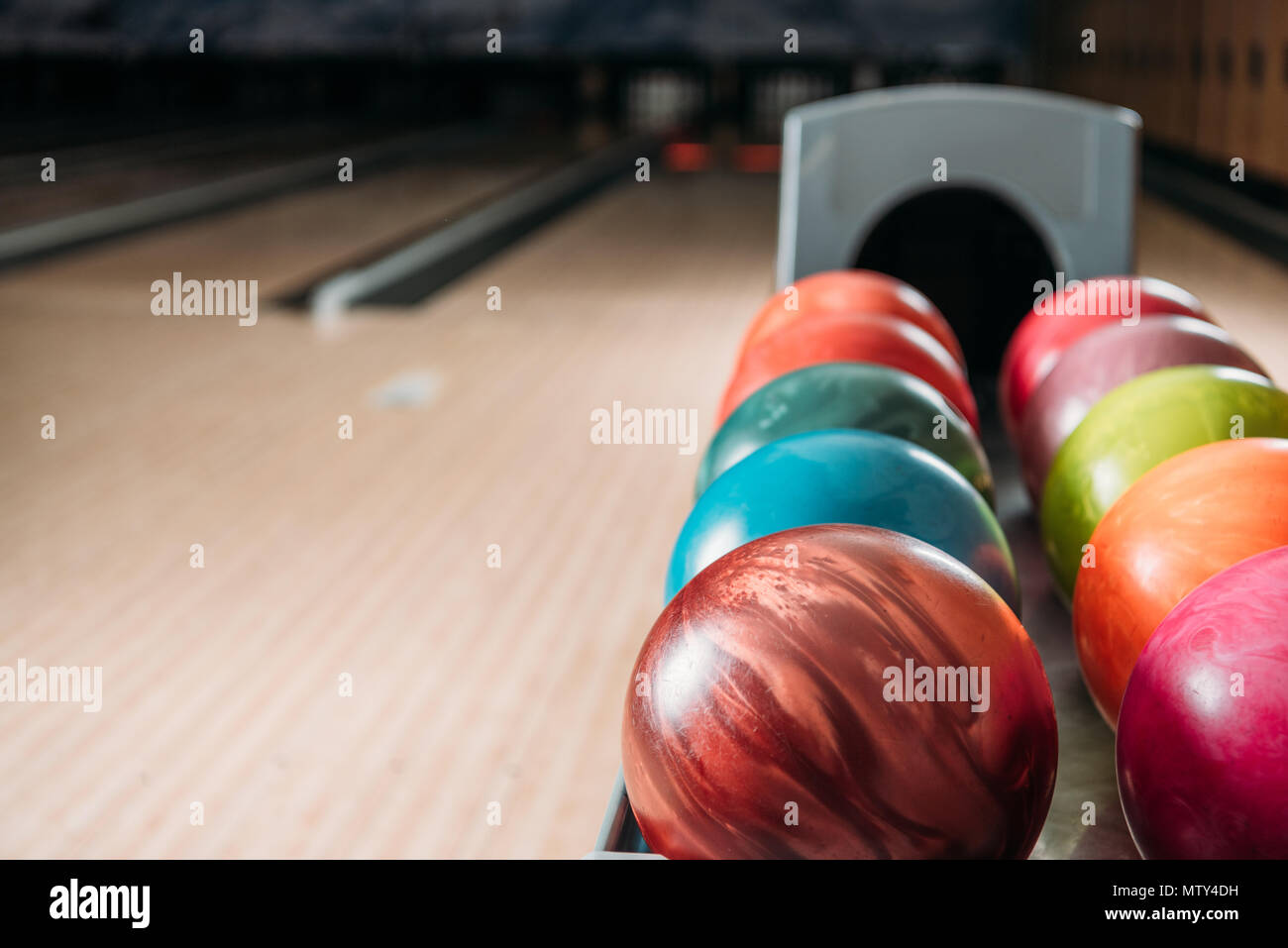 stand with colorful bowling balls in club Stock Photo - Alamy