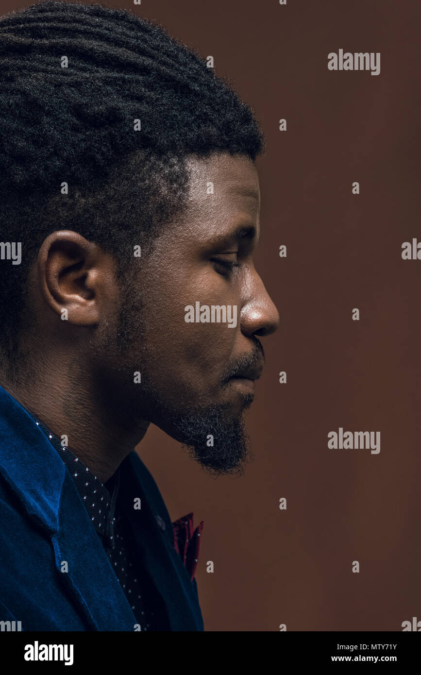 side view of handsome african american man with dreadlocks isolated on ...