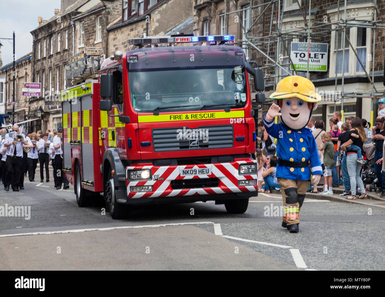 A Fire and Rescue vehicle and Fire Officer mascot in the parade at ...