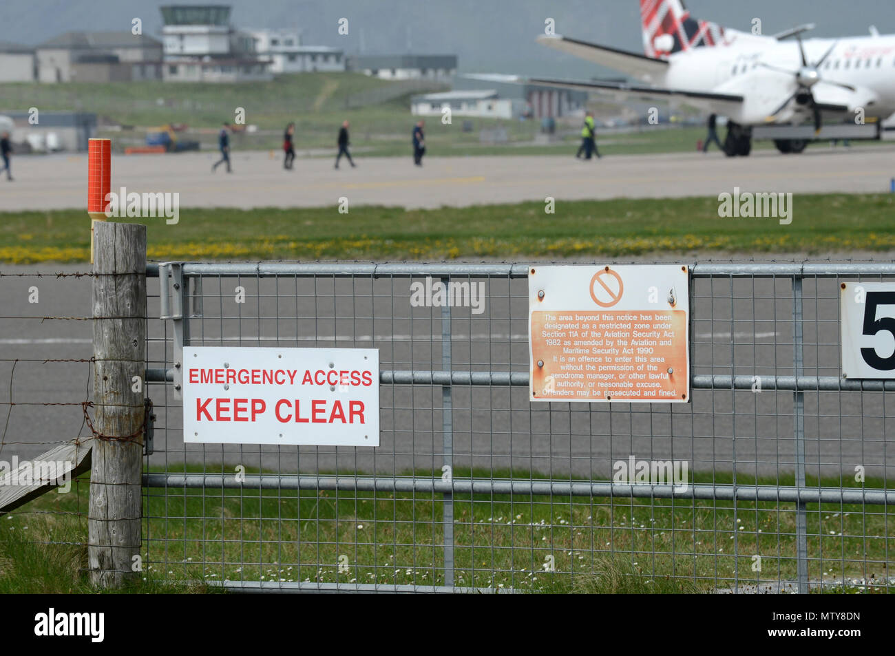 Warning signage on the fence round the perimeter of and airport Stock ...