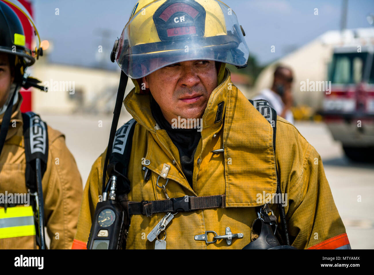 A Firefighter from Central America listens to their instructor about ...