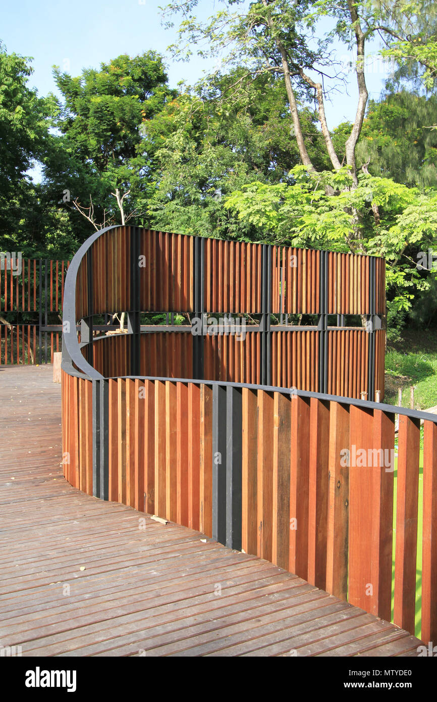 Wooden walkway with handrail in the park Stock Photo - Alamy