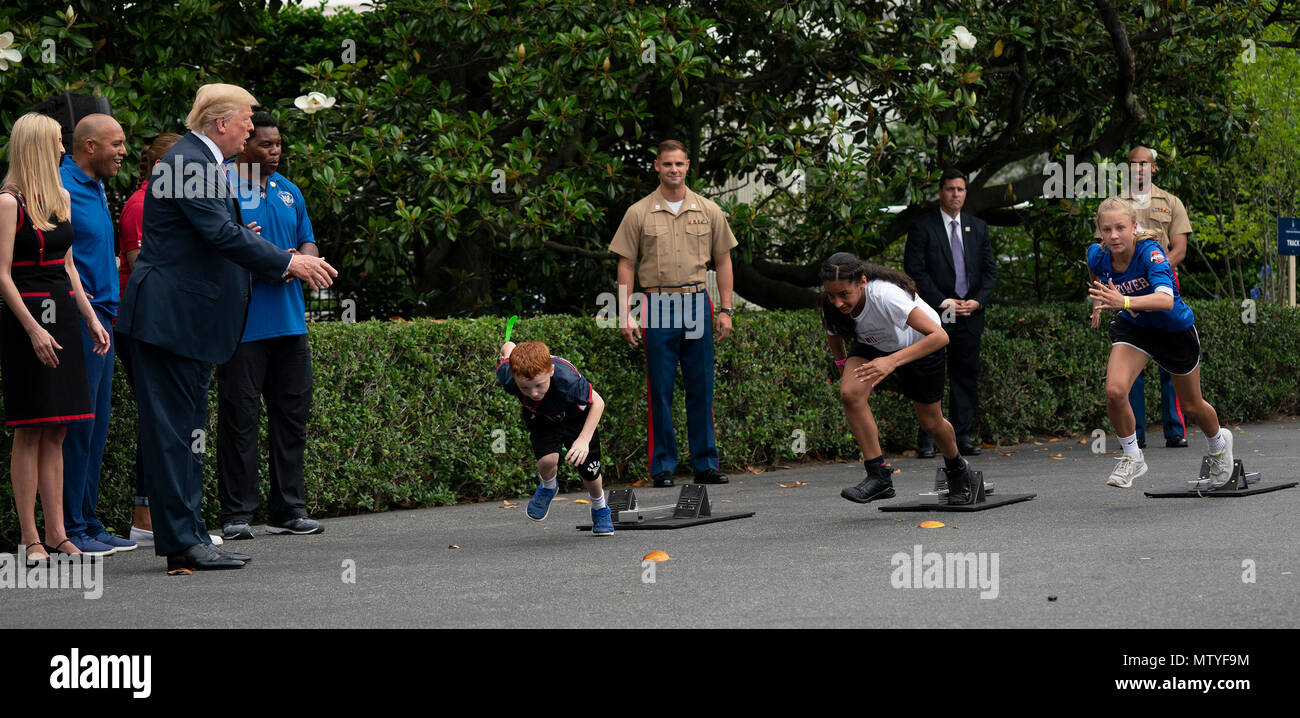 United States president Donald J. Trump cheers on runners participating ...
