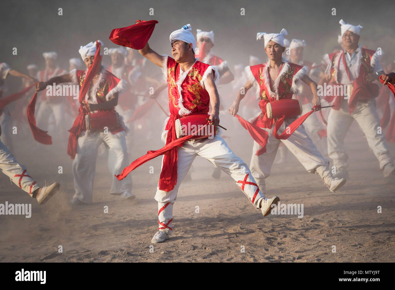 Yan'an, China's Shaanxi Province. 30th May, 2018. Villagers perform ...