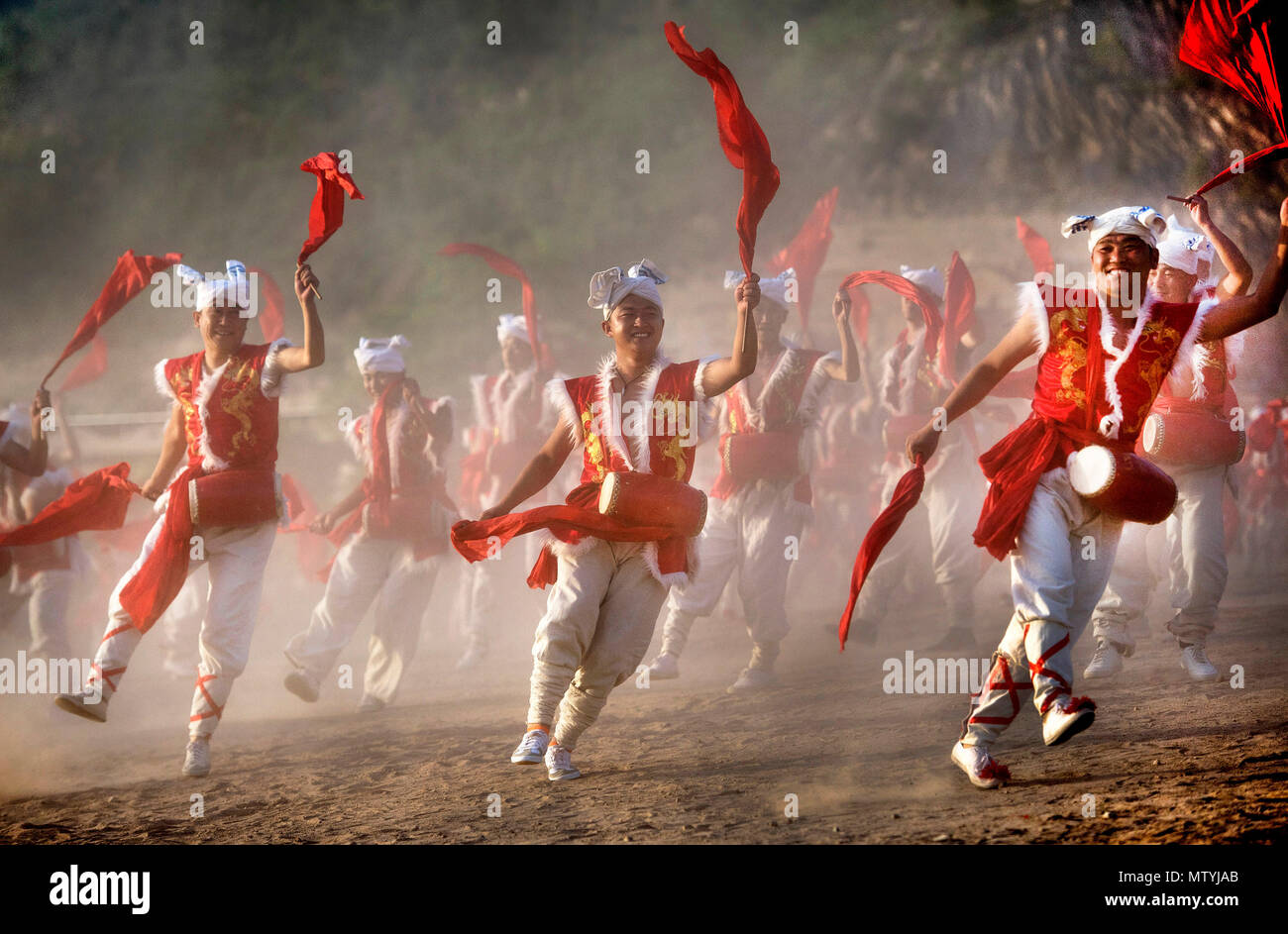 Yan'an, China's Shaanxi Province. 30th May, 2018. Villagers perform ...