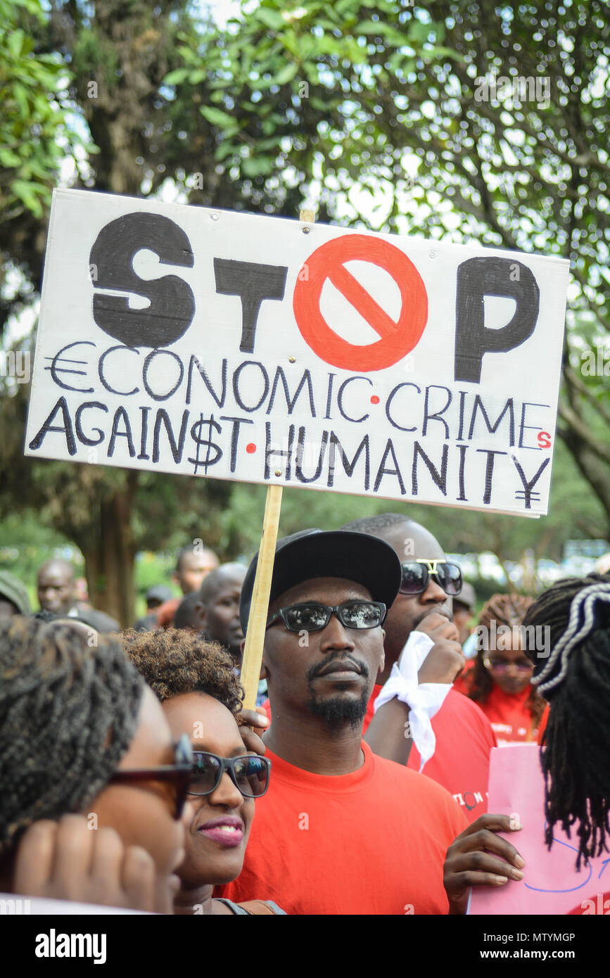 Nairobi, Kenya. 31st May, 2018. A protestor carry a placard as Kenyans ...