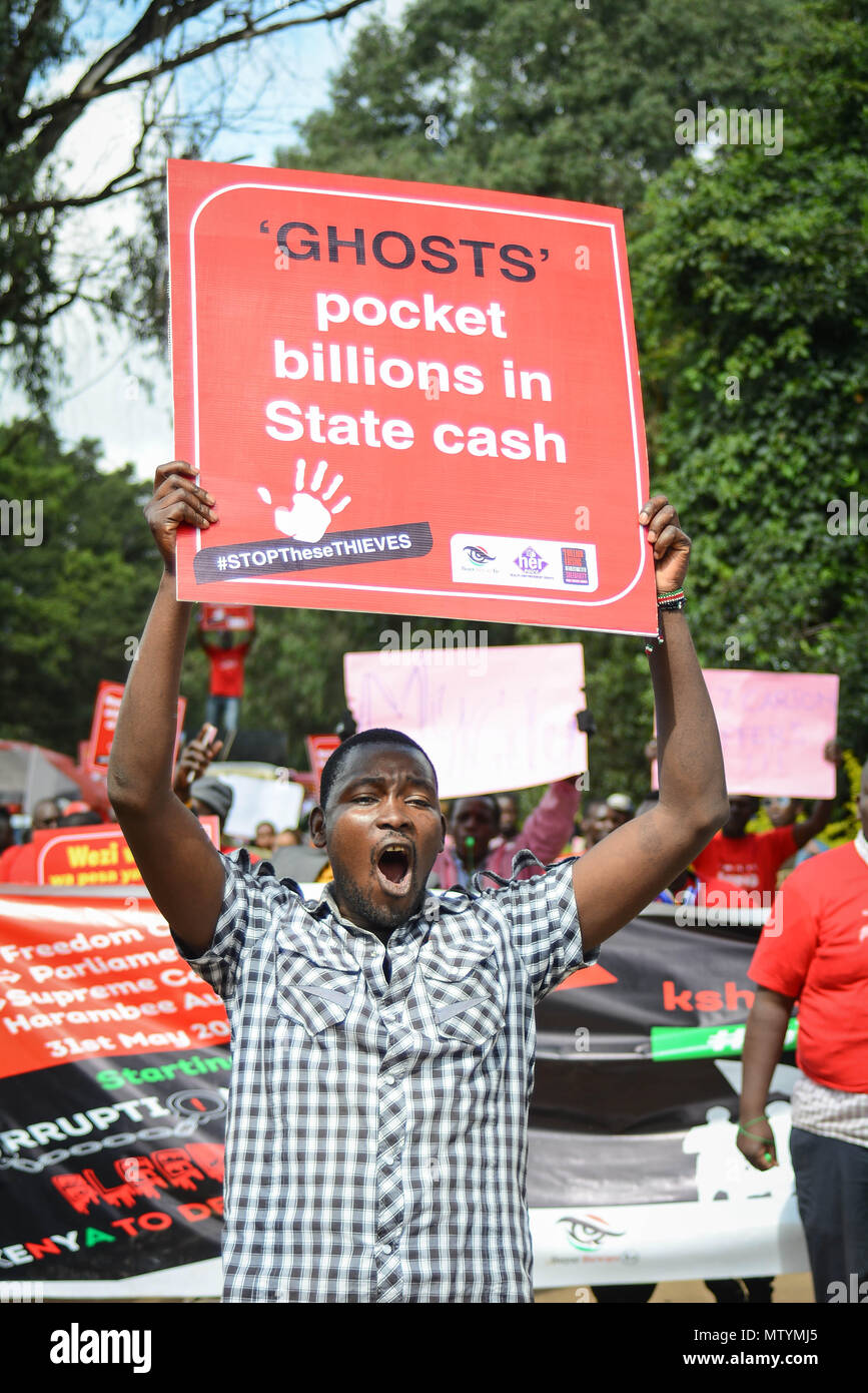 Nairobi, Kenya. 31st May, 2018. A protestor carry a placard as Kenyans ...
