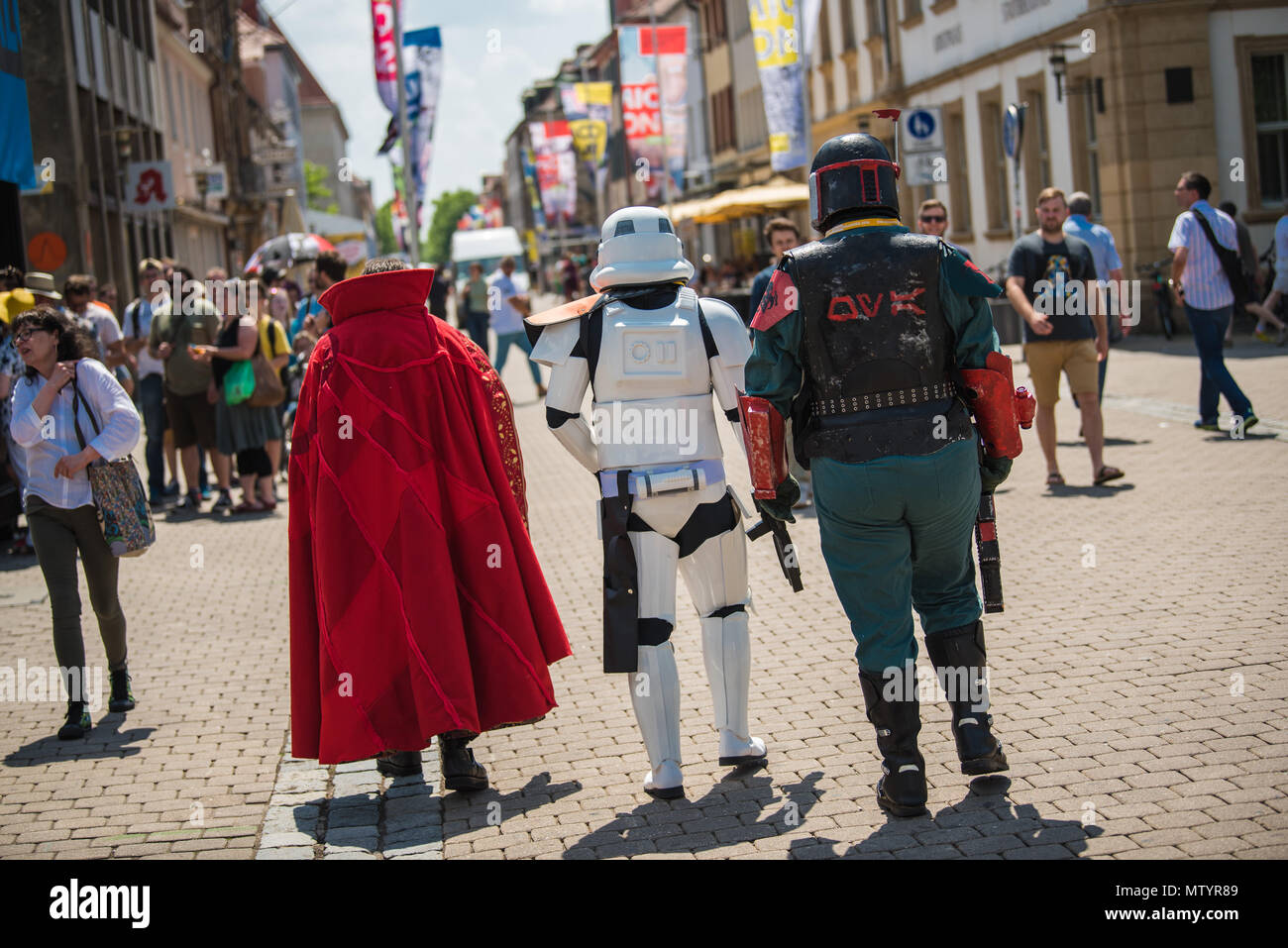 31 May 2018, Germany, Erlangen: Three cosplayers in Star Wars costumes ...