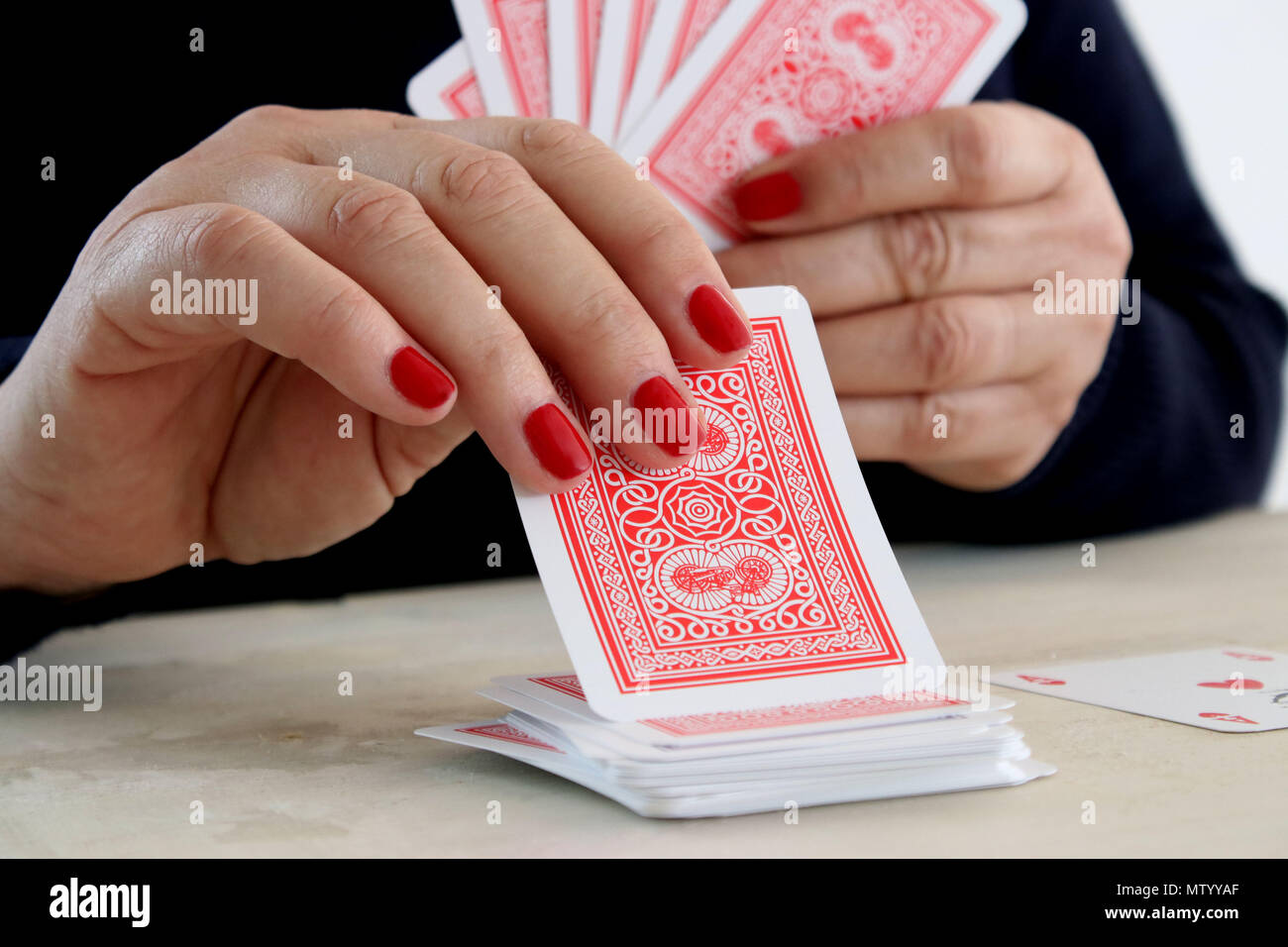 Woman playing cards Stock Photo - Alamy