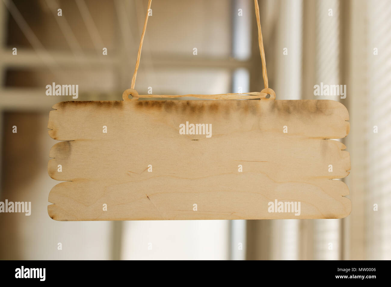 Blank wooden sign hanging from ceiling Stock Photo - Alamy