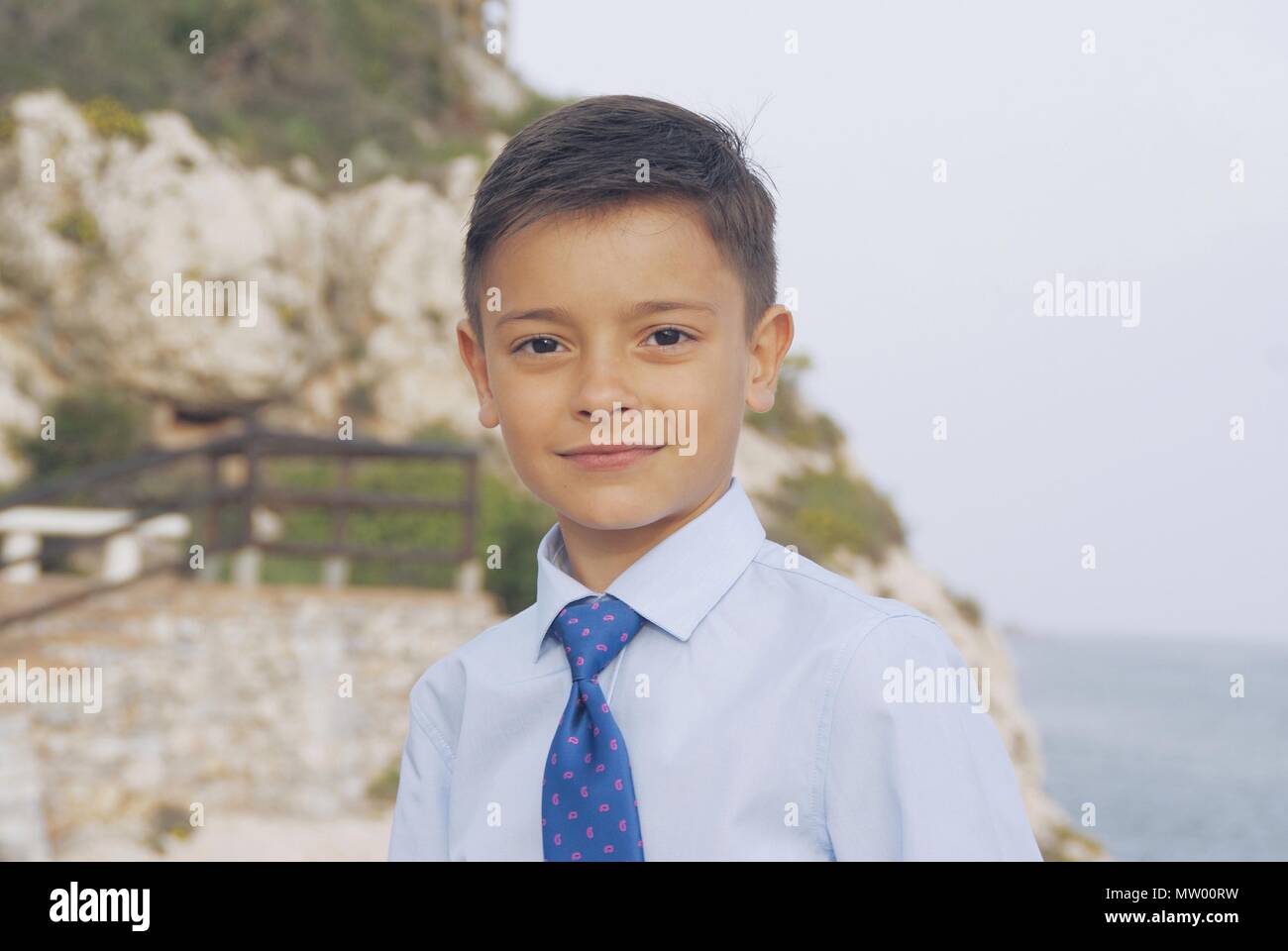 Portrait of a smiling boy wearing a shirt and tie, Malaga, Andalucia ...