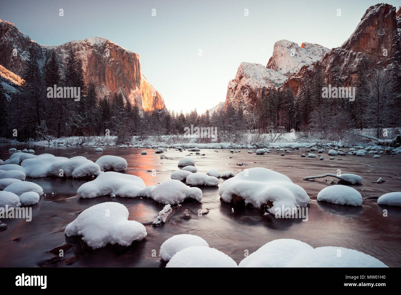 Snow covered rocks in Merced river, Yosemite, California, United States ...