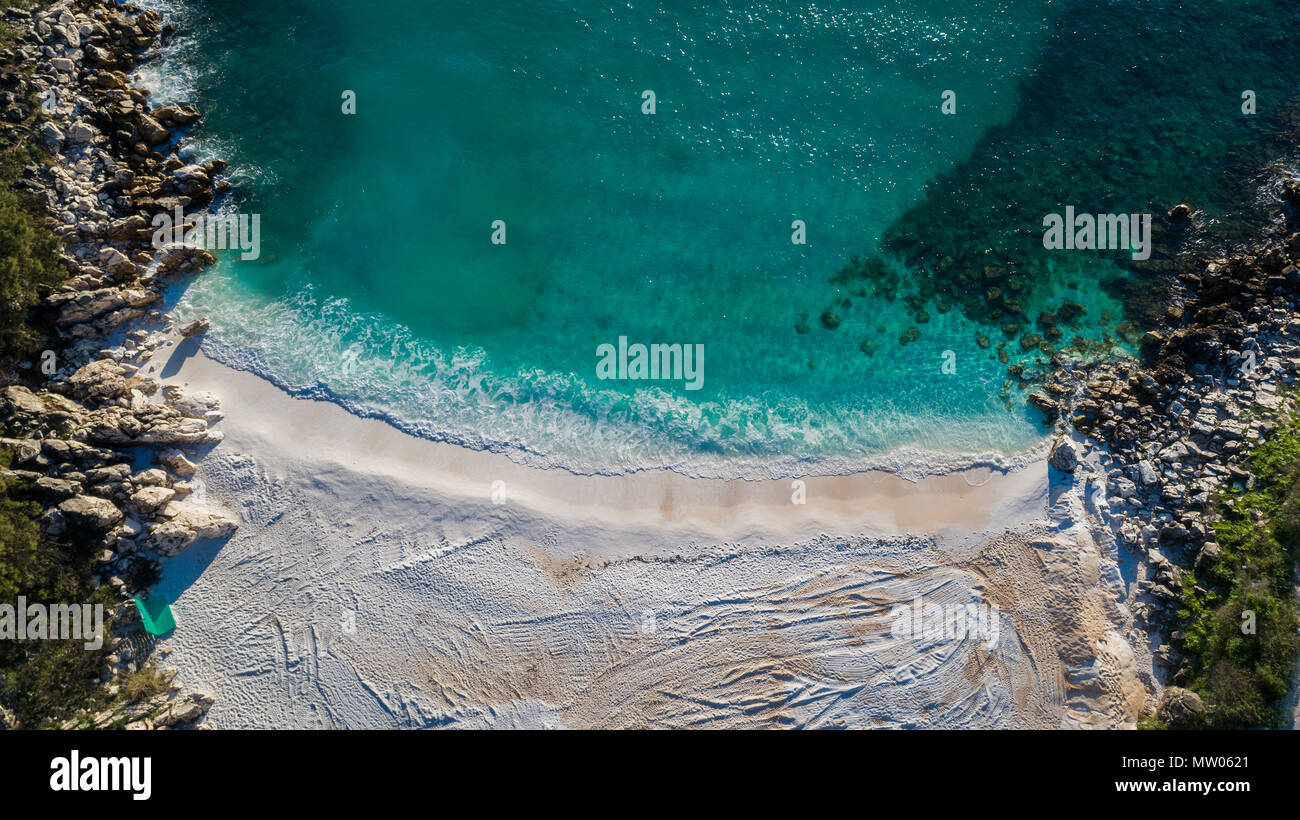 Aerial view of Marble beach. The most beautiful white beach in Greece ...