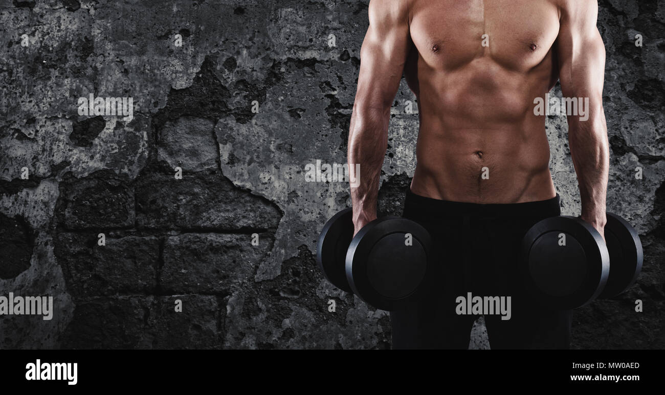 Athletic man training biceps at the gym Stock Photo - Alamy