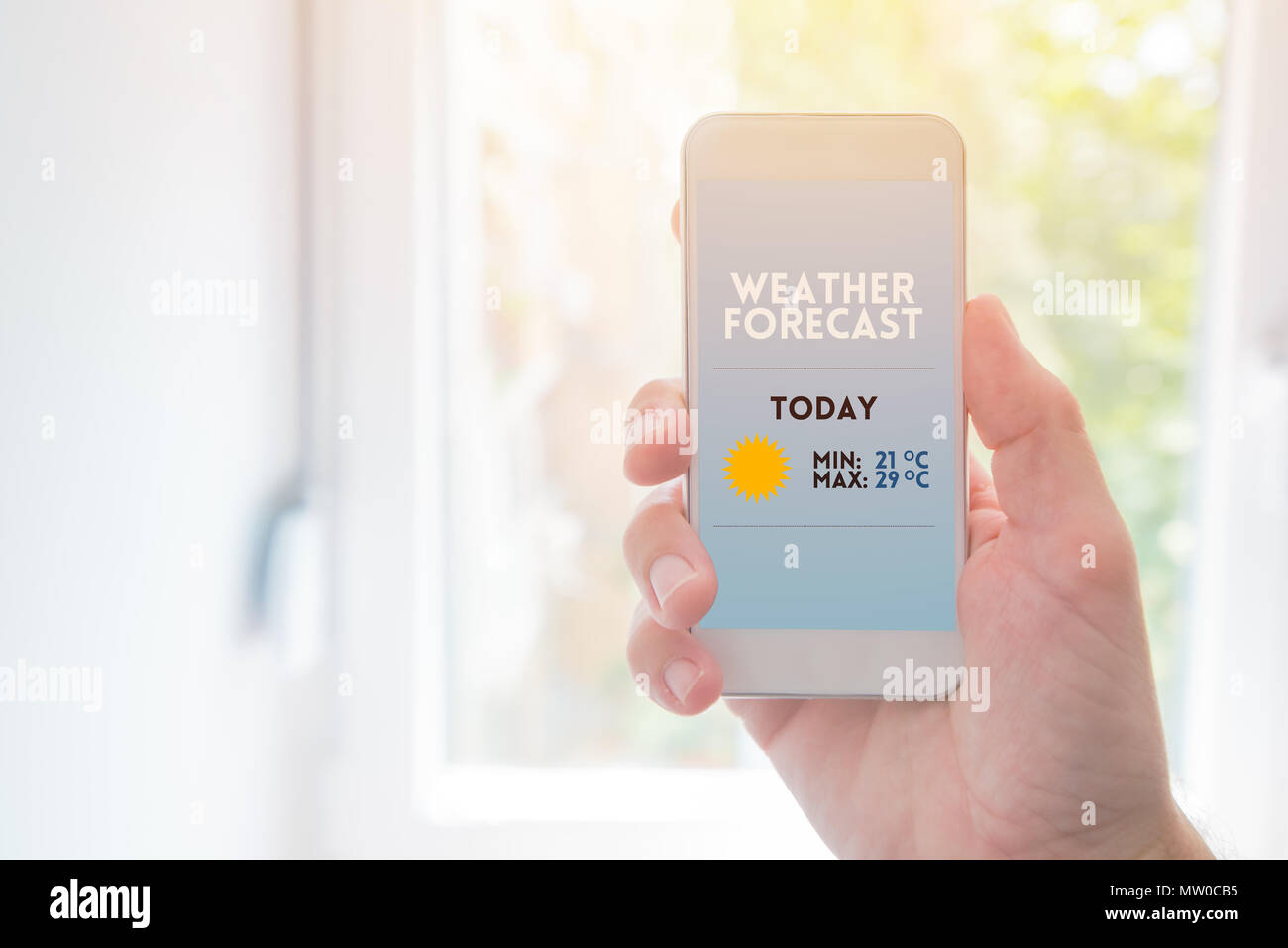 Weather forecast smartphone app mock up, man holding mobile phone with ...