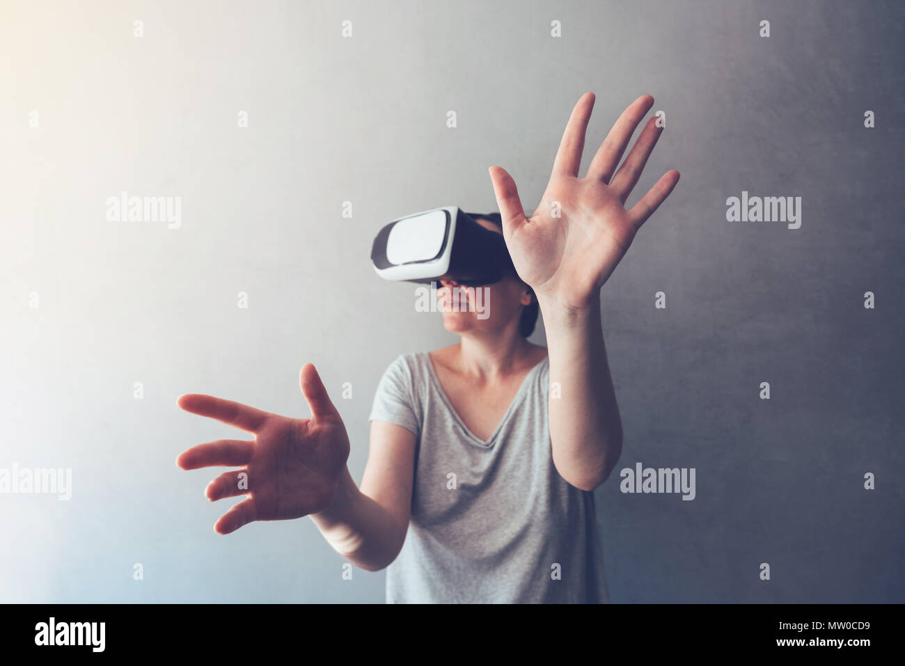 Woman immersed in virtual reality, female person using modern VR ...