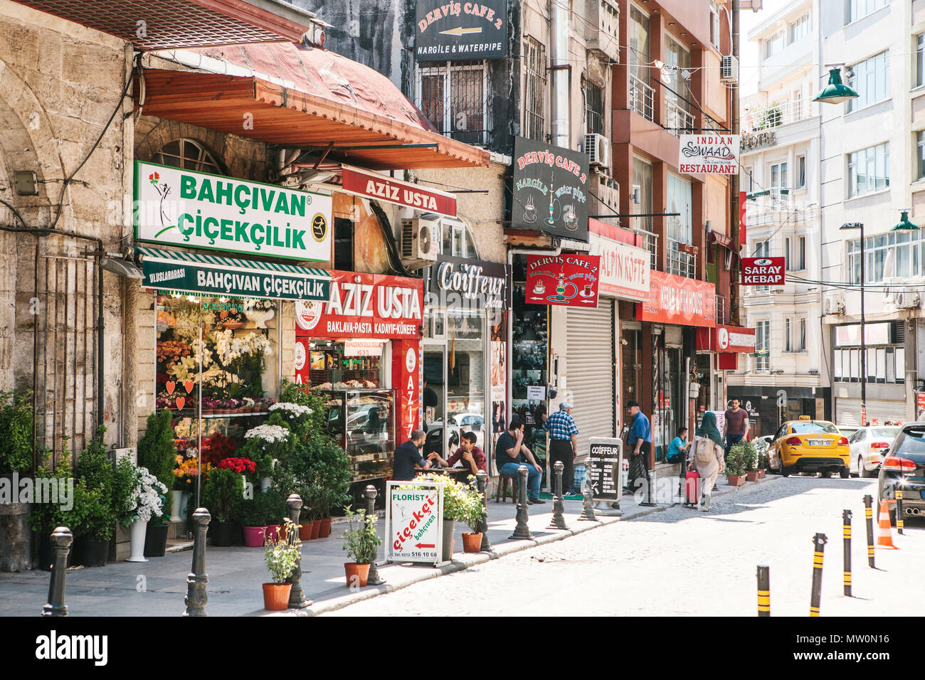 Editorial image of shopping district with various shops and restaurants ...
