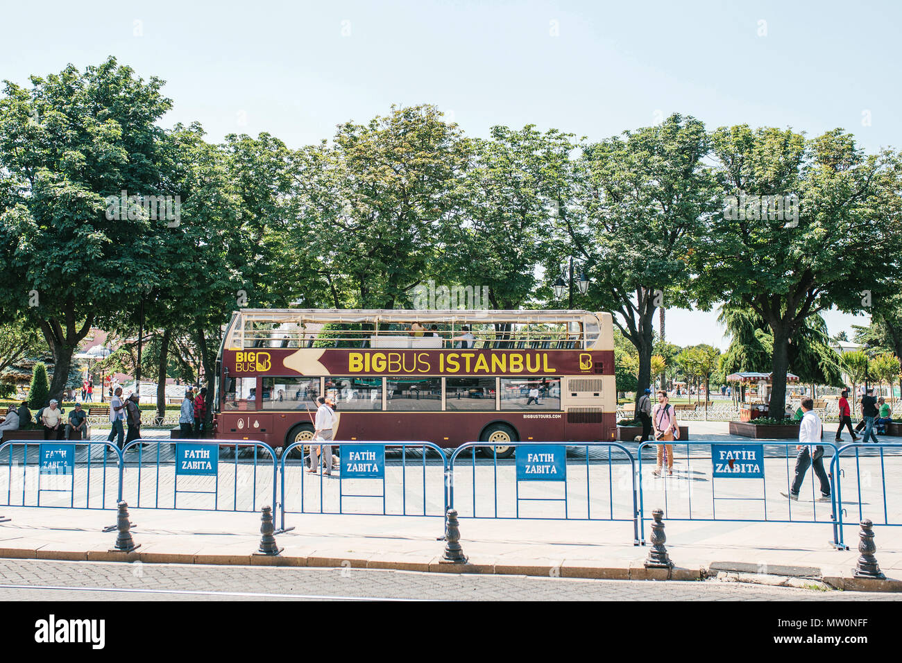 Editorial image of tourist sightseeing bus picking up passengers at the ...